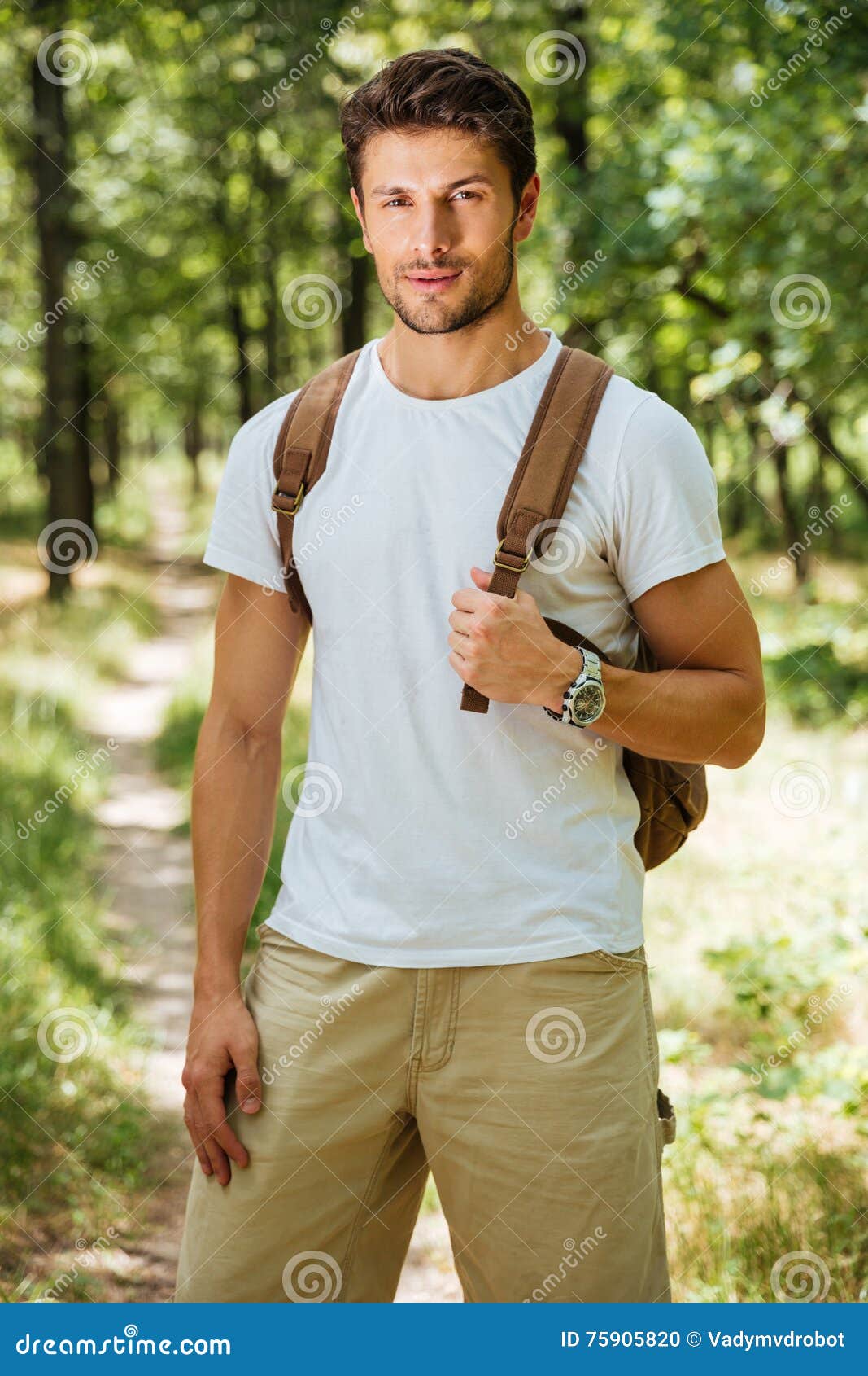 Man Holding Backpack and Standing in Forest Stock Photo - Image of ...