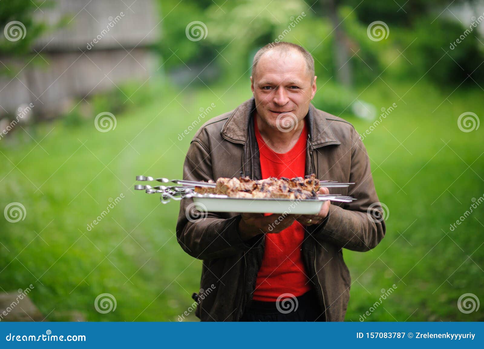 Man Holding Barbecue in the Hands Stock Image - Image of meat, outside ...