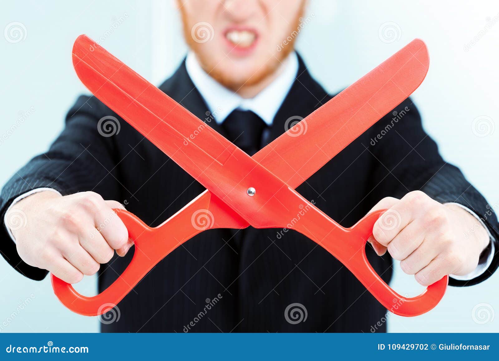 Man Holding Big Red Scissors Stock Photo - Image of office, indoor ...