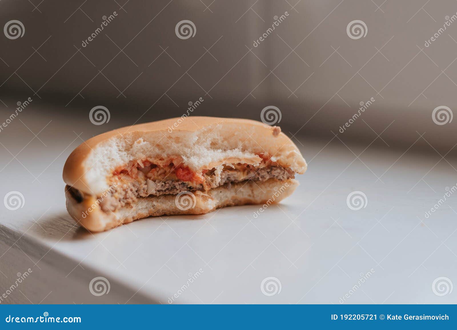 The Man is Holding a Bitten Burger Stock Image - Image of recipies ...