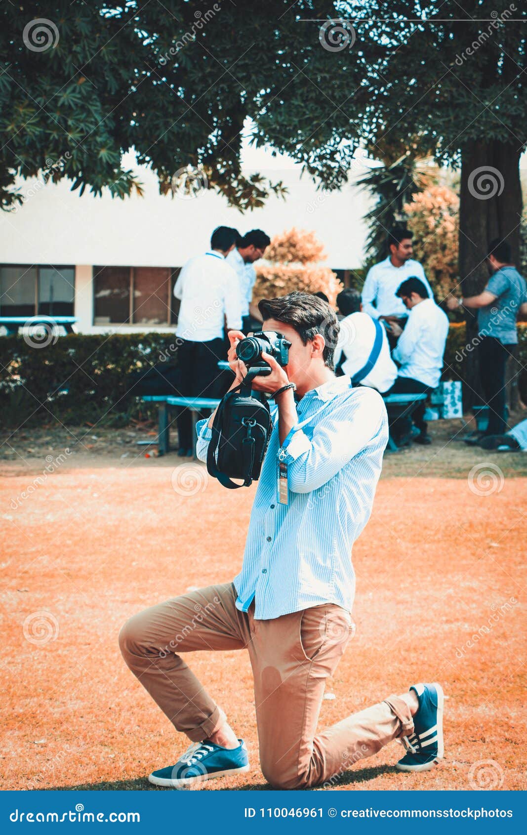 Man Holding A Black Dslr Camera Picture. Image: 110046961