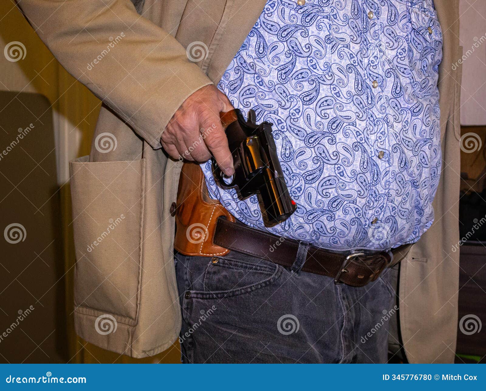 A Black Revolver With A Loaded Speed Loader With 38 Special Full Metal ...