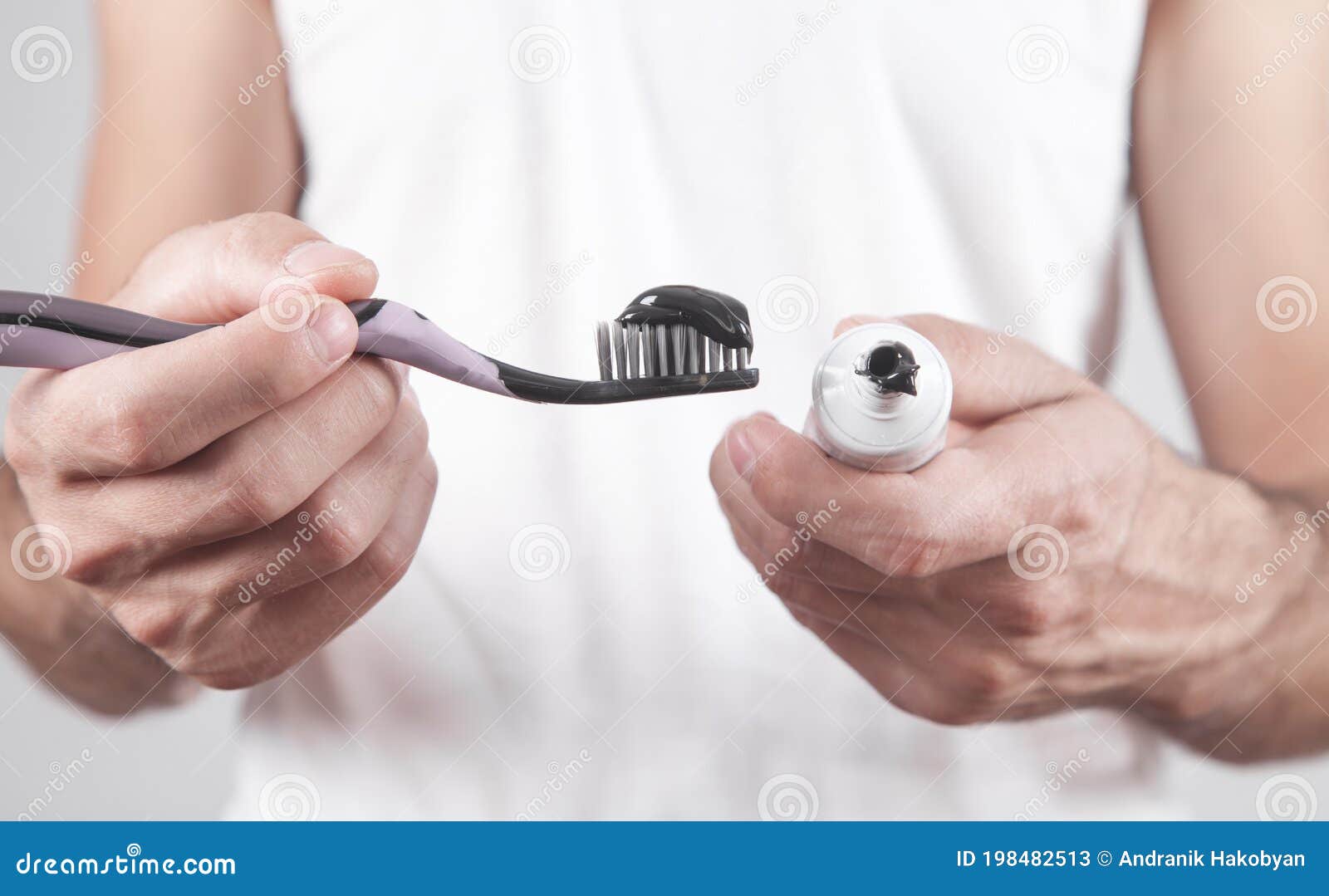 Man Holding Black Toothpaste and Toothbrush Stock Image - Image of ...