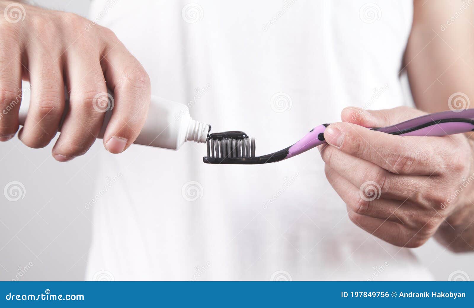 Man Holding Black Toothpaste and Toothbrush Stock Photo - Image of ...