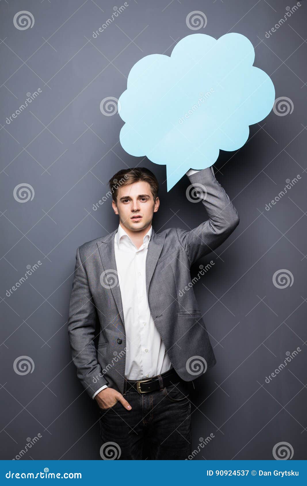 Man Holding Blue Blank Speech Bubble with Space for Text on Grey ...