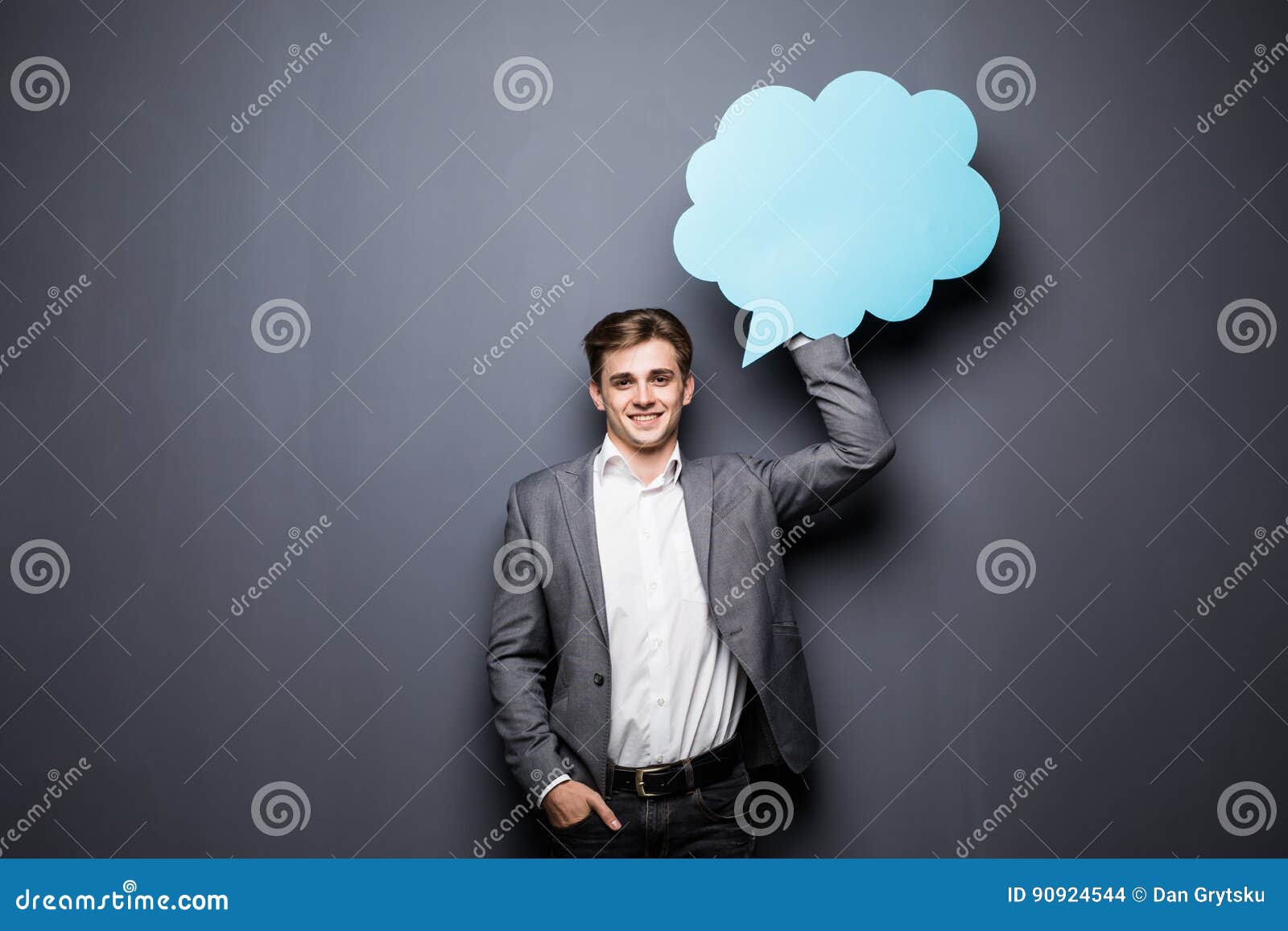 Man Holding Blue Blank Speech Bubble with Space for Text on Grey ...