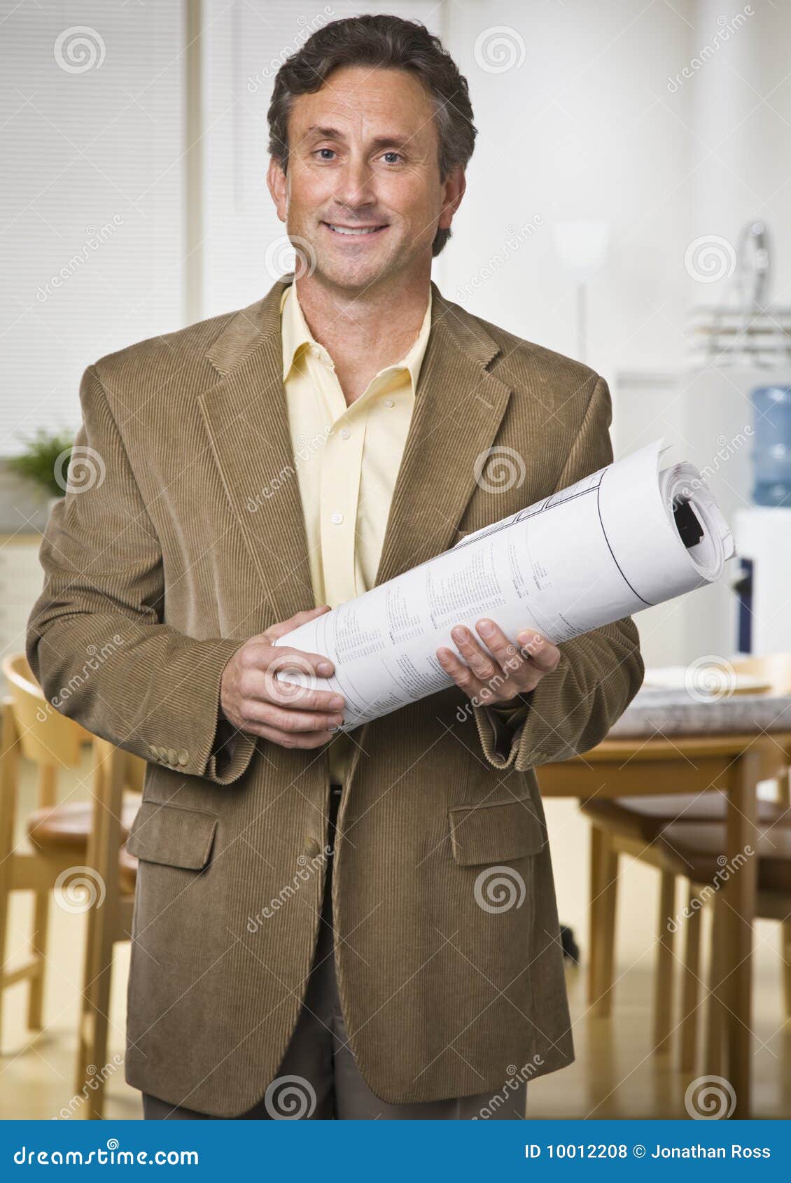 Man Holding Blueprints stock photo. Image of caucasian - 10012208