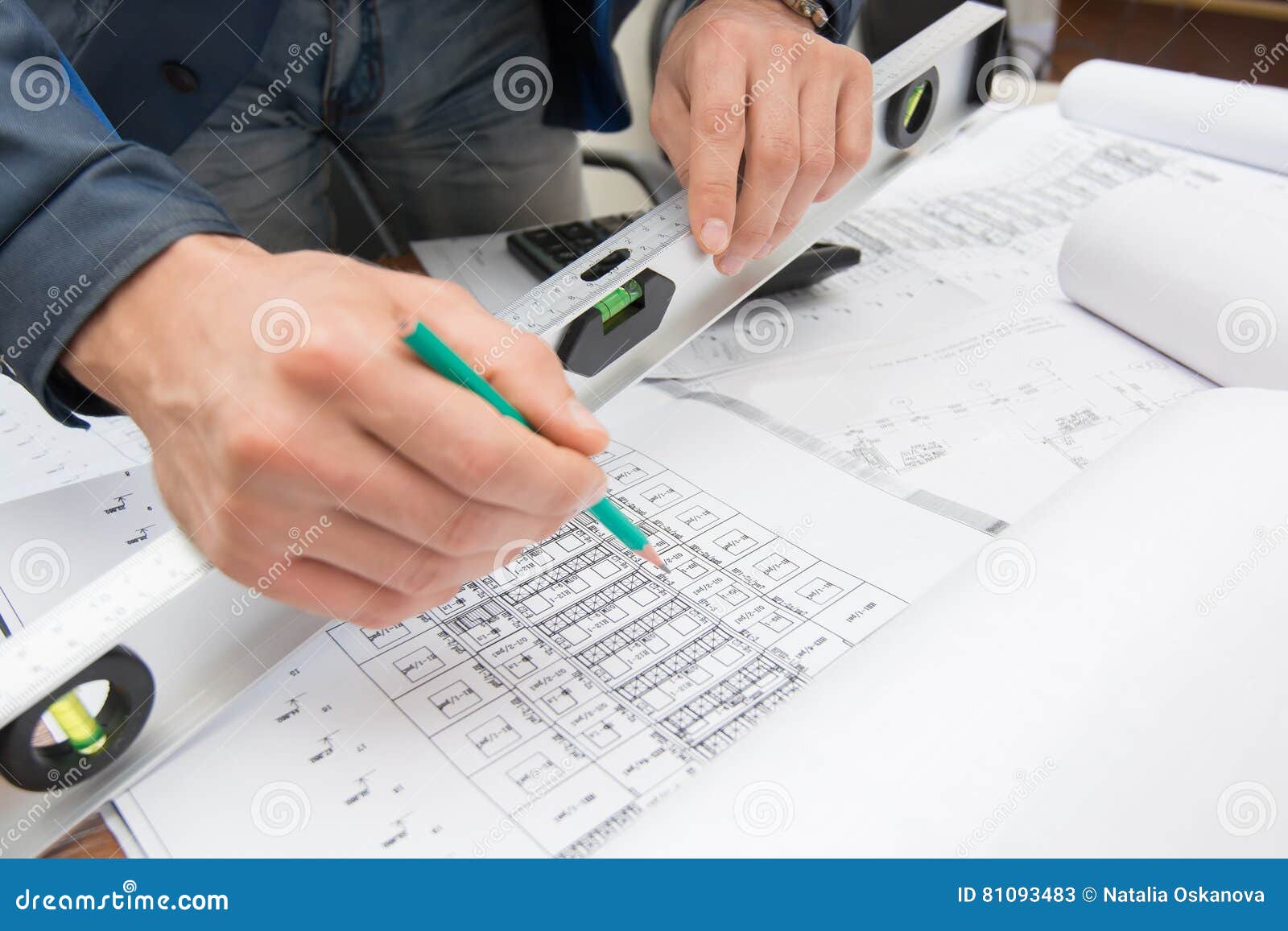 Man Holding Blueprints at Construction Site Stock Image - Image of ...