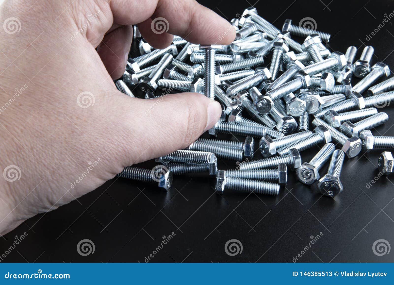 Man holding a bolt stock image. Image of isolated, tool - 146385513