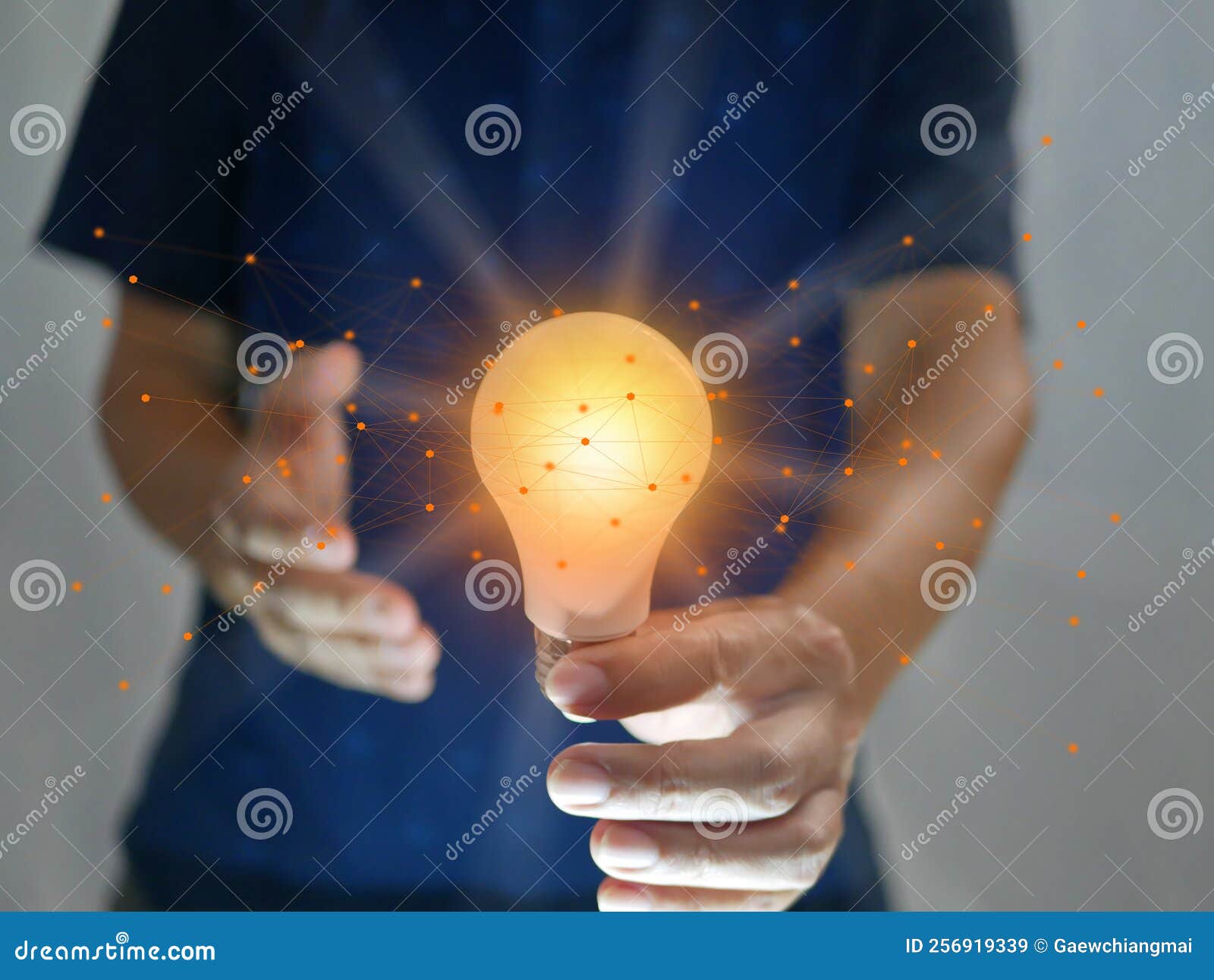 Man Holding Bright Shining Light Bulb Represents a New Idea, Thought ...