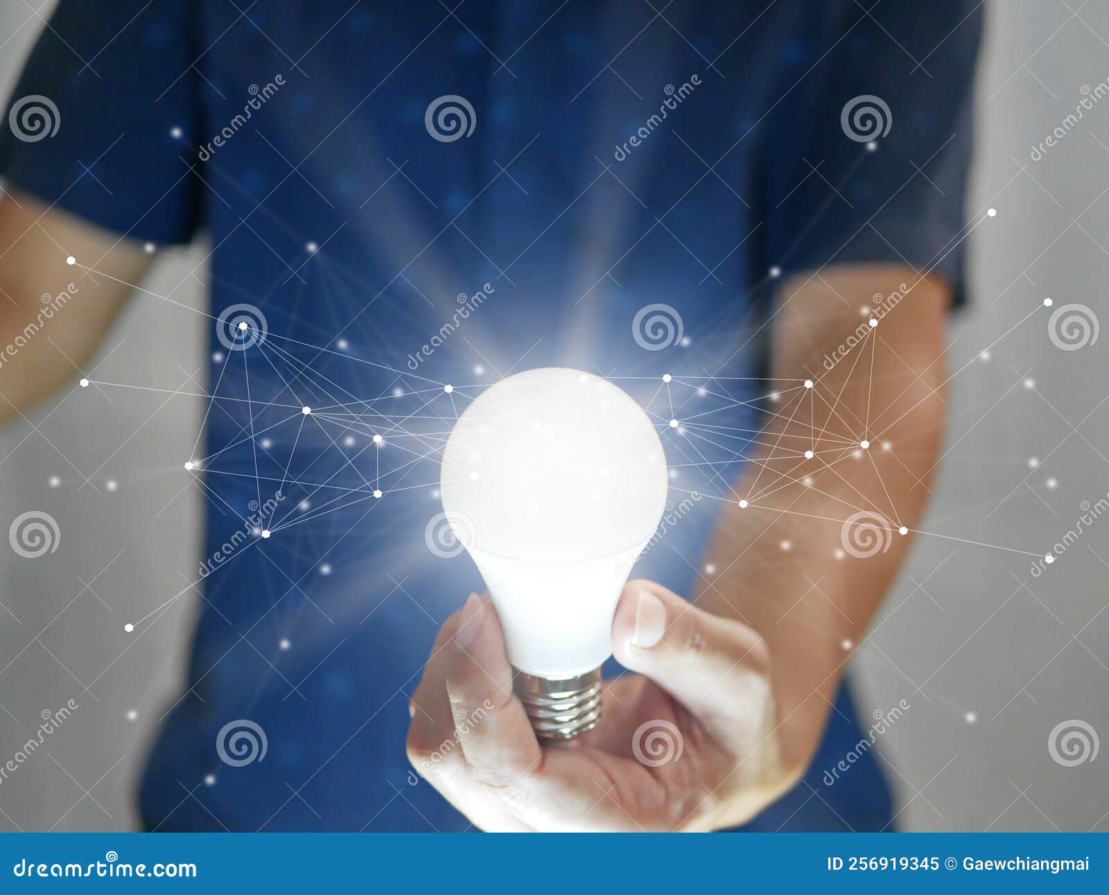 Man Holding Bright Shining Light Bulb Represents a New Idea, Thought ...