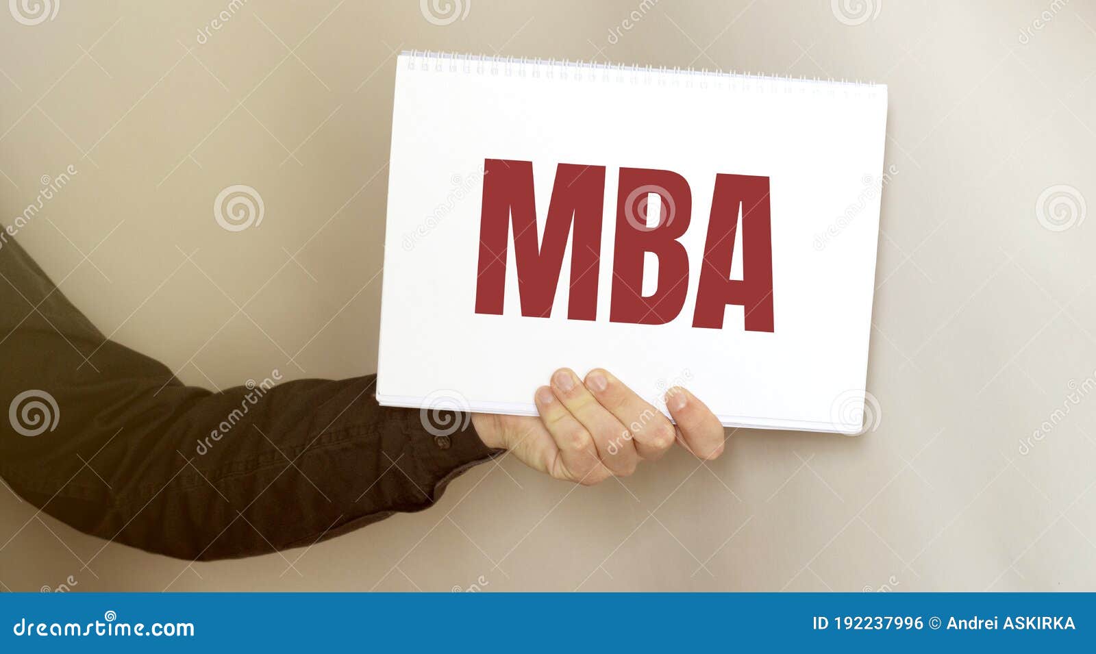 Man Holding Brochure With MBA Text On Grey Background. Mock Up For ...