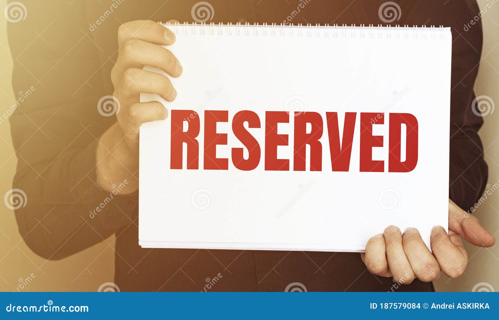 Man Holding Brochure with RESERVED Text on Grey Background. Mock Up for ...