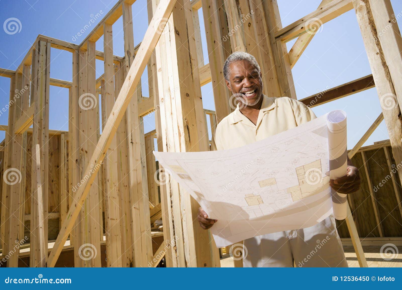 Man Holding Building Plans stock photo. Image of clothing - 12536450 Man Holding Building Plans stock photo. Image of clothing - 12536450