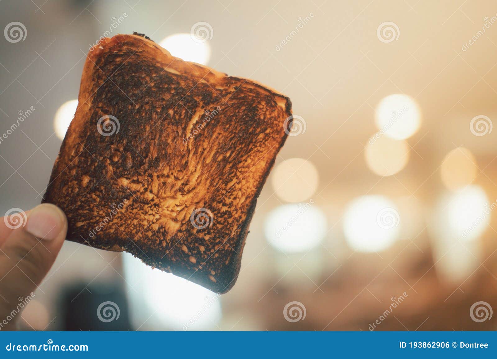 Man Holding Burnt Toast Bread Slice Stock Photo - Image of bakery, hand ...
