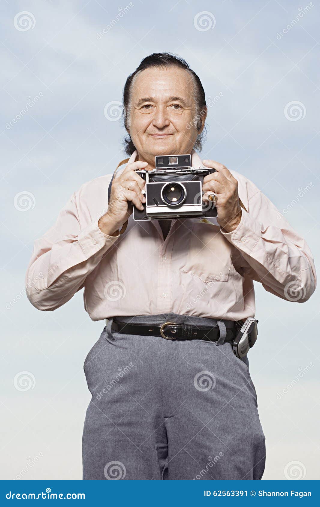 Man holding a camera stock image. Image of photographer - 62563391