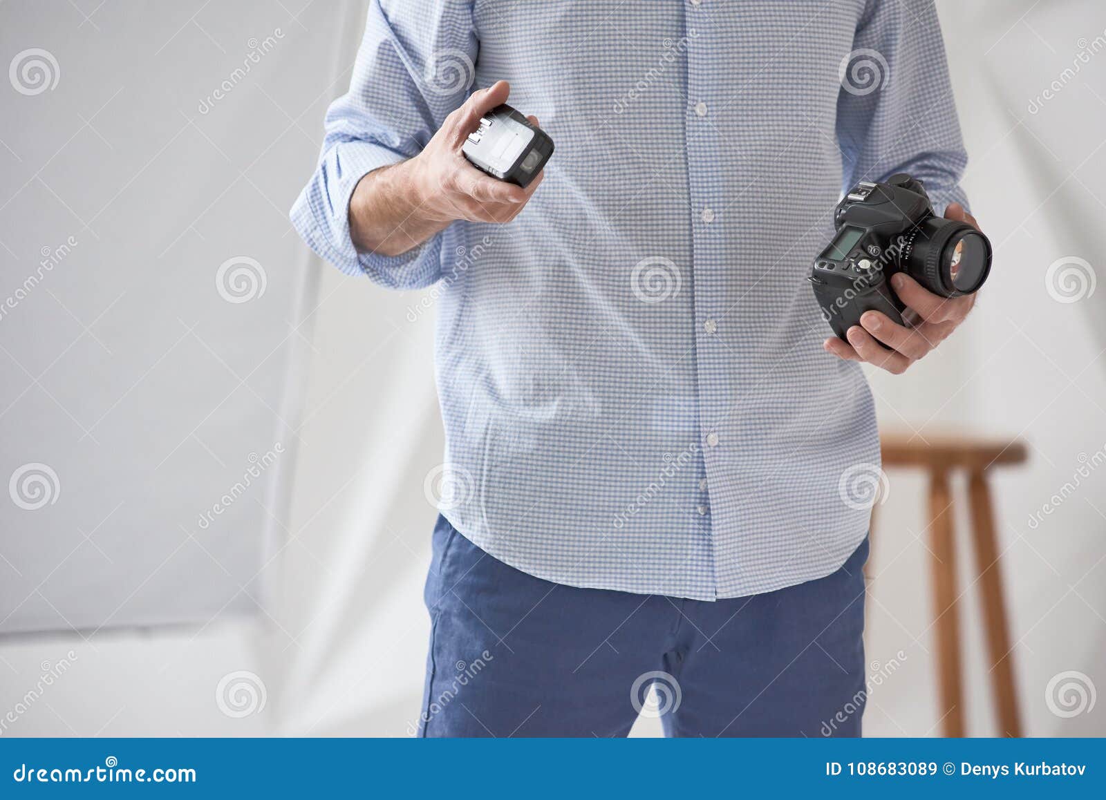 Man holding camera stock image. Image of equipment, photographer ...
