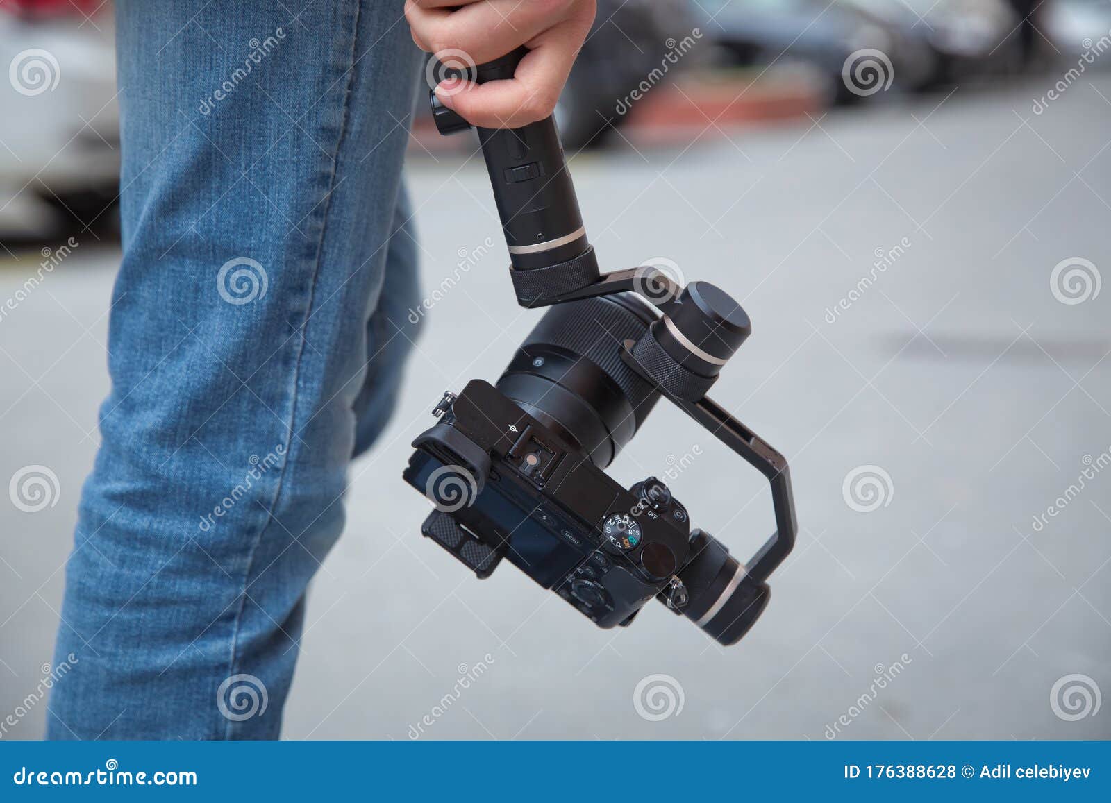 An Unidentified Man Holding Gimbal a Camera Stabilizer . Man Holding ...