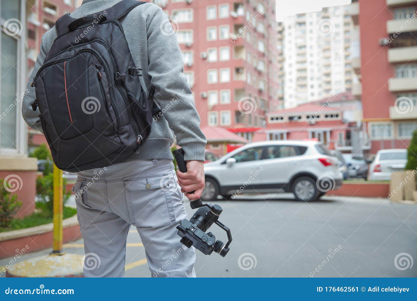An Unidentified Man Holding Gimbal a Camera Stabilizer . Man Holding ...
