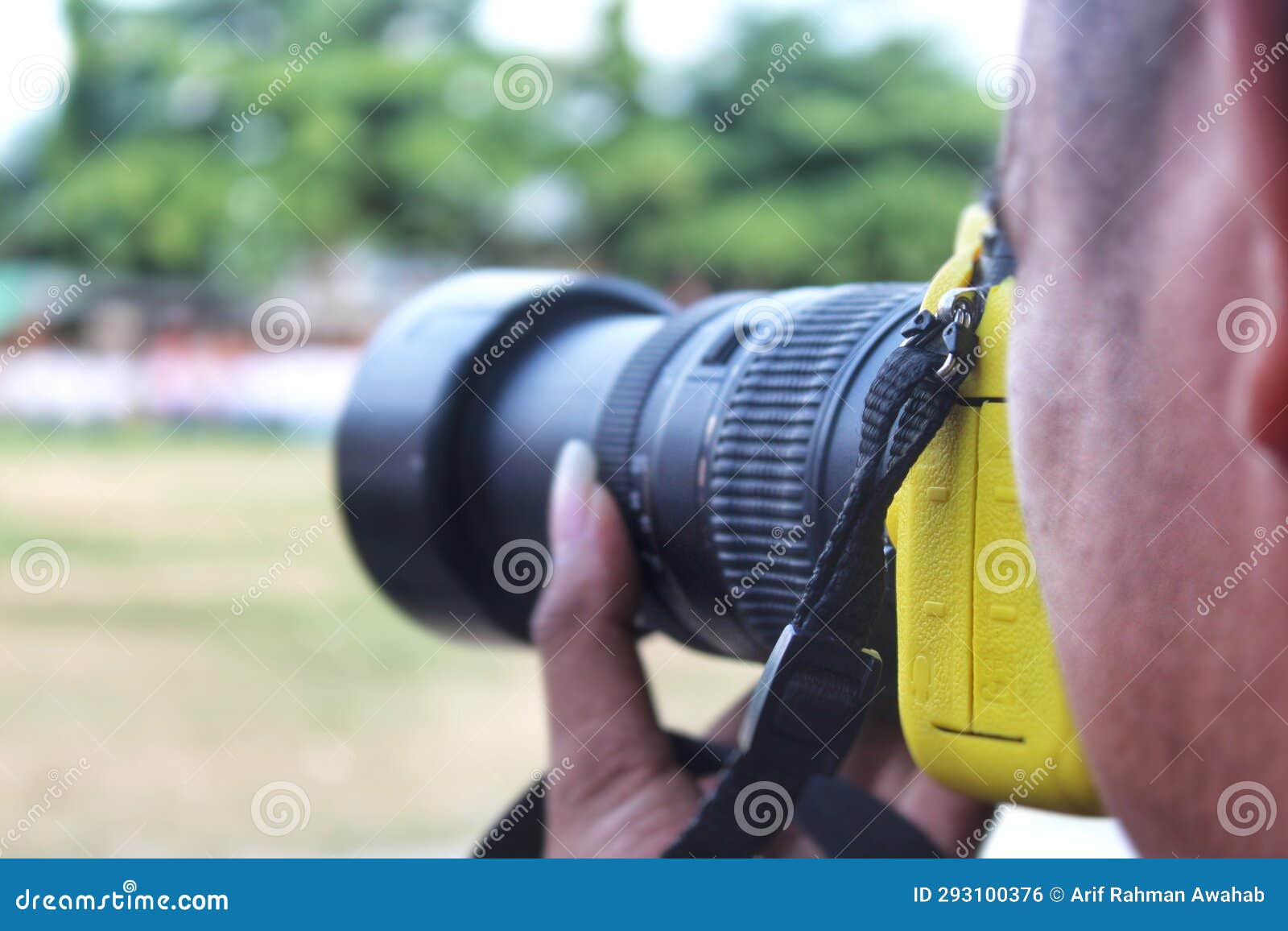 Man Holding a Camera Shooting Objects at the Field during the Day Stock ...