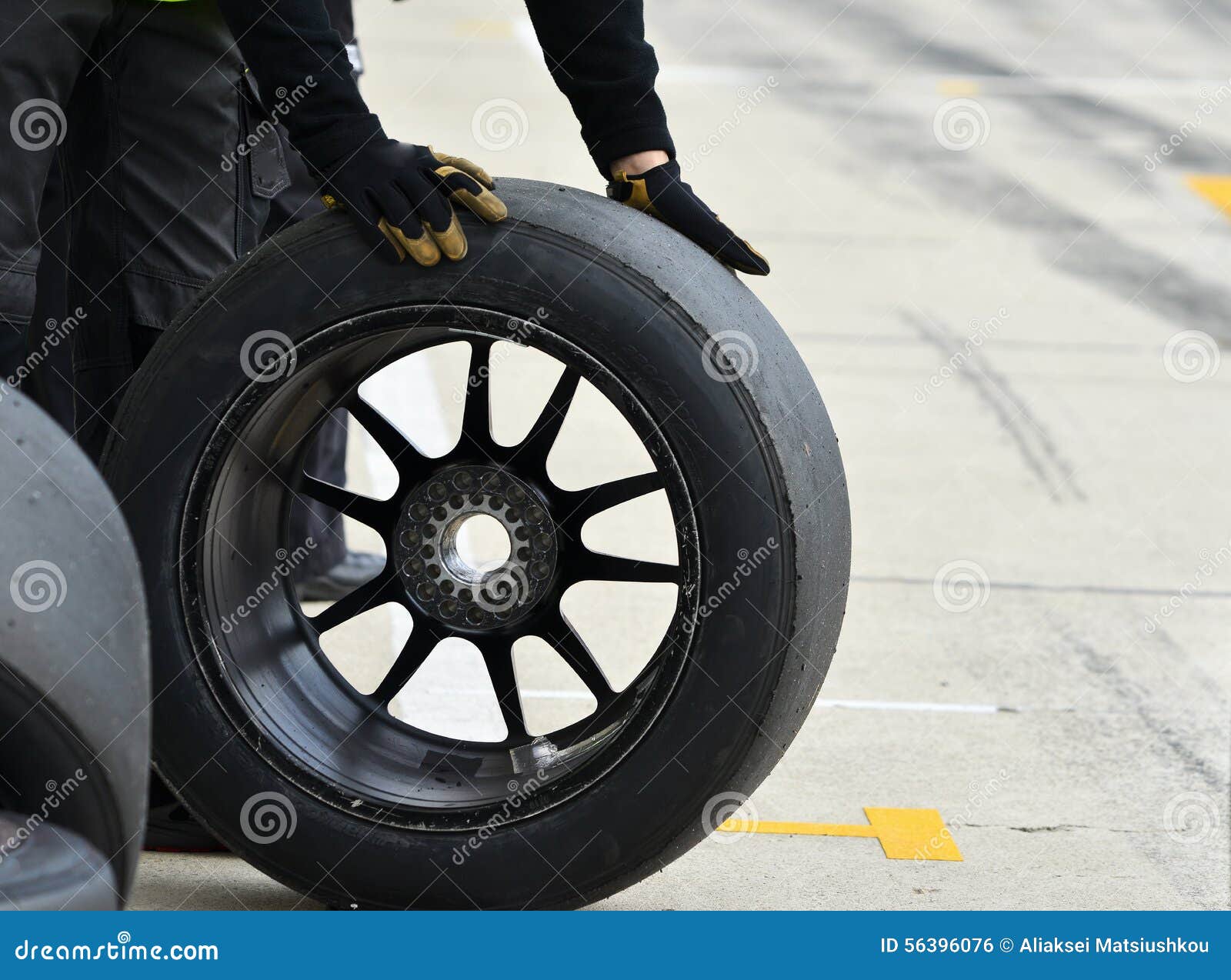 Man Holding a Car Wheels on White Background. Stock Photo - Image of ...