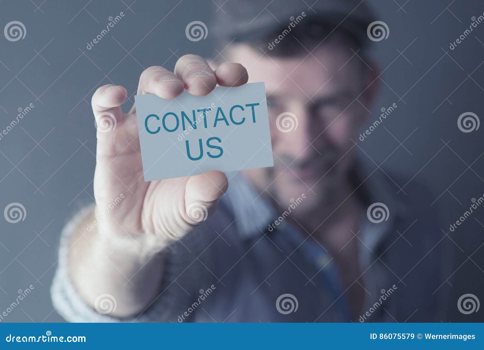 Man Holding Card with the Words Contact Us Stock Image - Image of ...