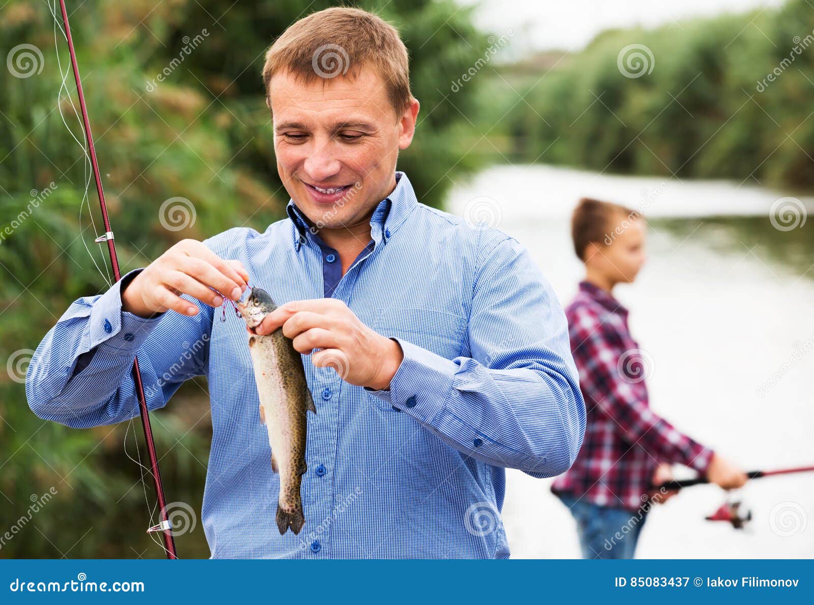 Man holding catch fish stock image. Image of lake, adult - 85083437