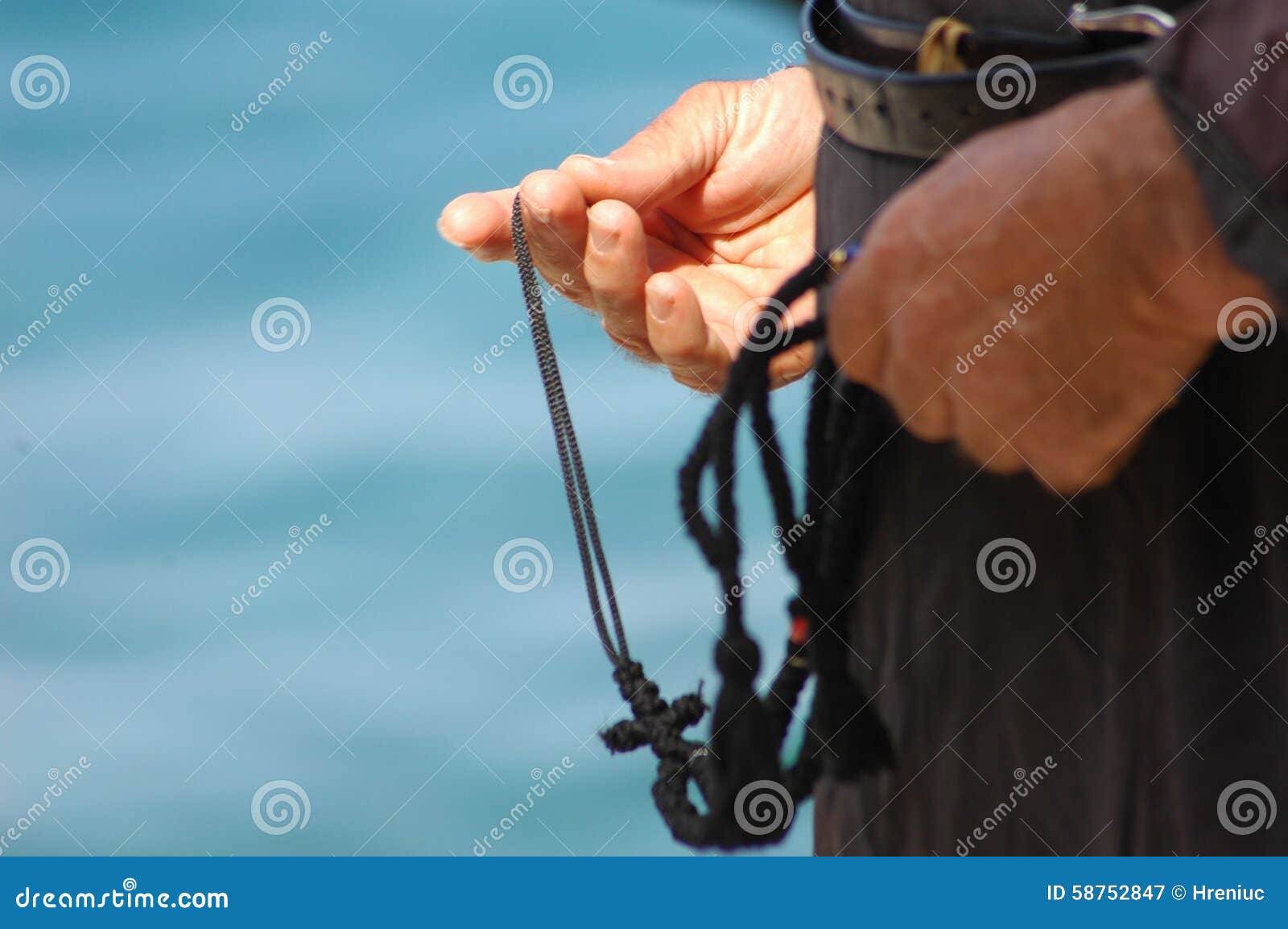 Man Holding a Chain with a Cross Stock Image - Image of prayer, cross ...