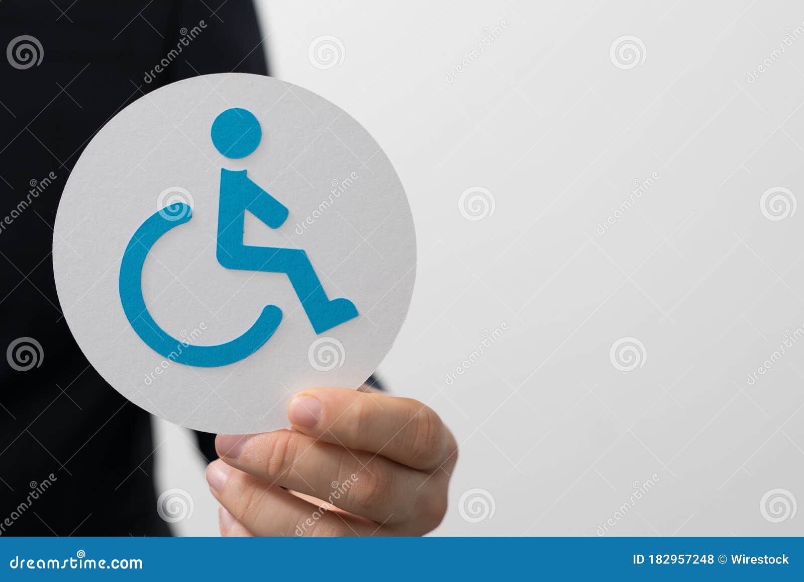Man Holding a Circle Sign with a Disability Symbol Stock Photo - Image ...