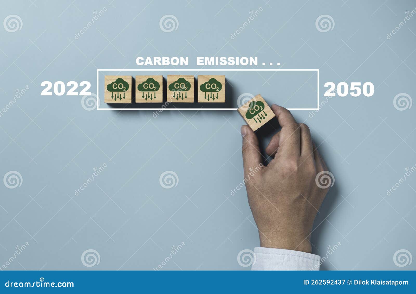 Man Holding CO2 Reducing Icon with Virtual Loading for Decrease CO2 , Carbon Footprint and ...