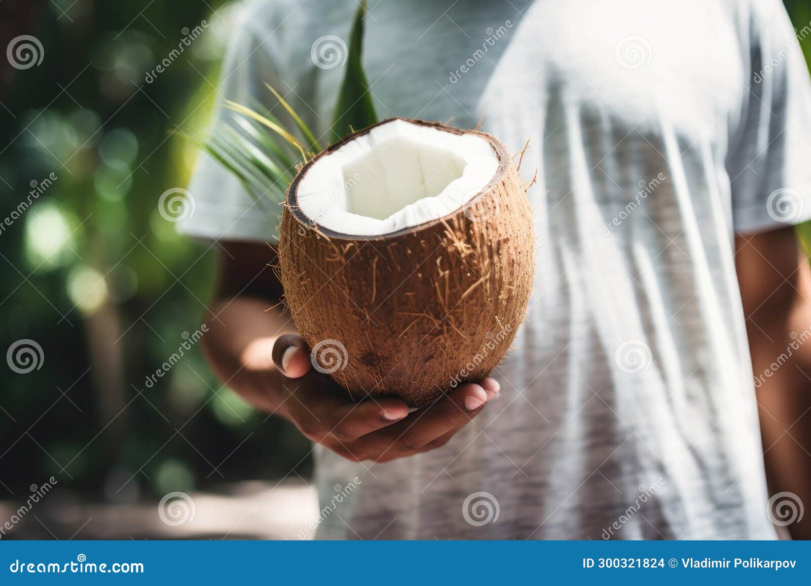 Man Holding a Coconut in His Hand in Nature Stock Photo - Image of ...