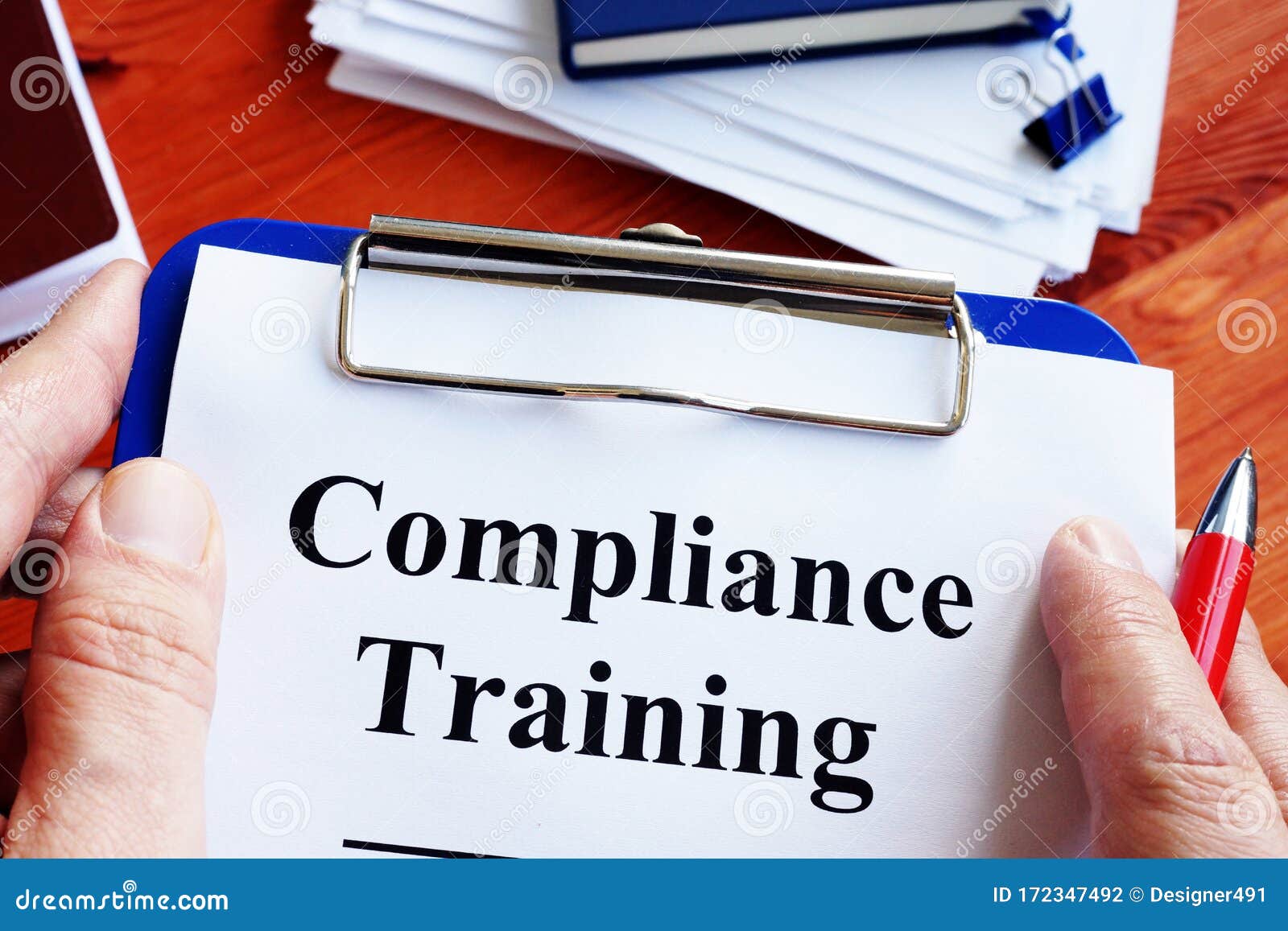 Man is Holding Compliance Training Report. Stock Photo - Image of ...