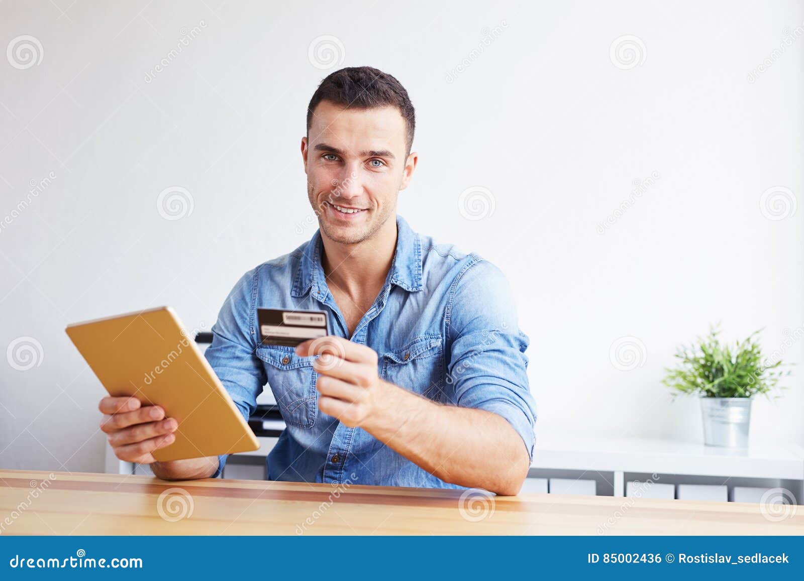 Man Holding Credit Card and Digital Tablet Stock Photo - Image of ...