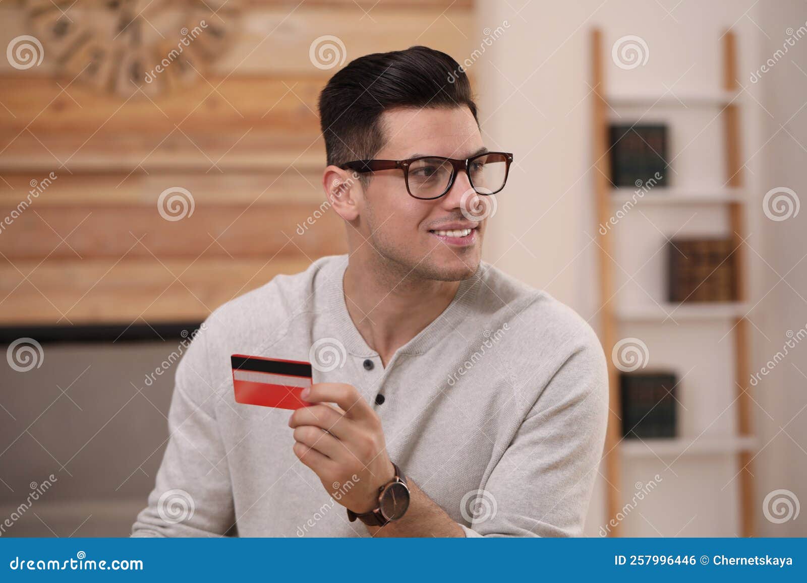 Man Holding Credit Card for Online Payment at Home Stock Photo - Image ...