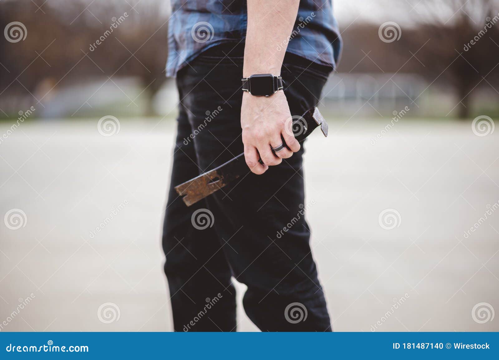 Man holding a crowbar stock photo. Image of black, person - 181487140