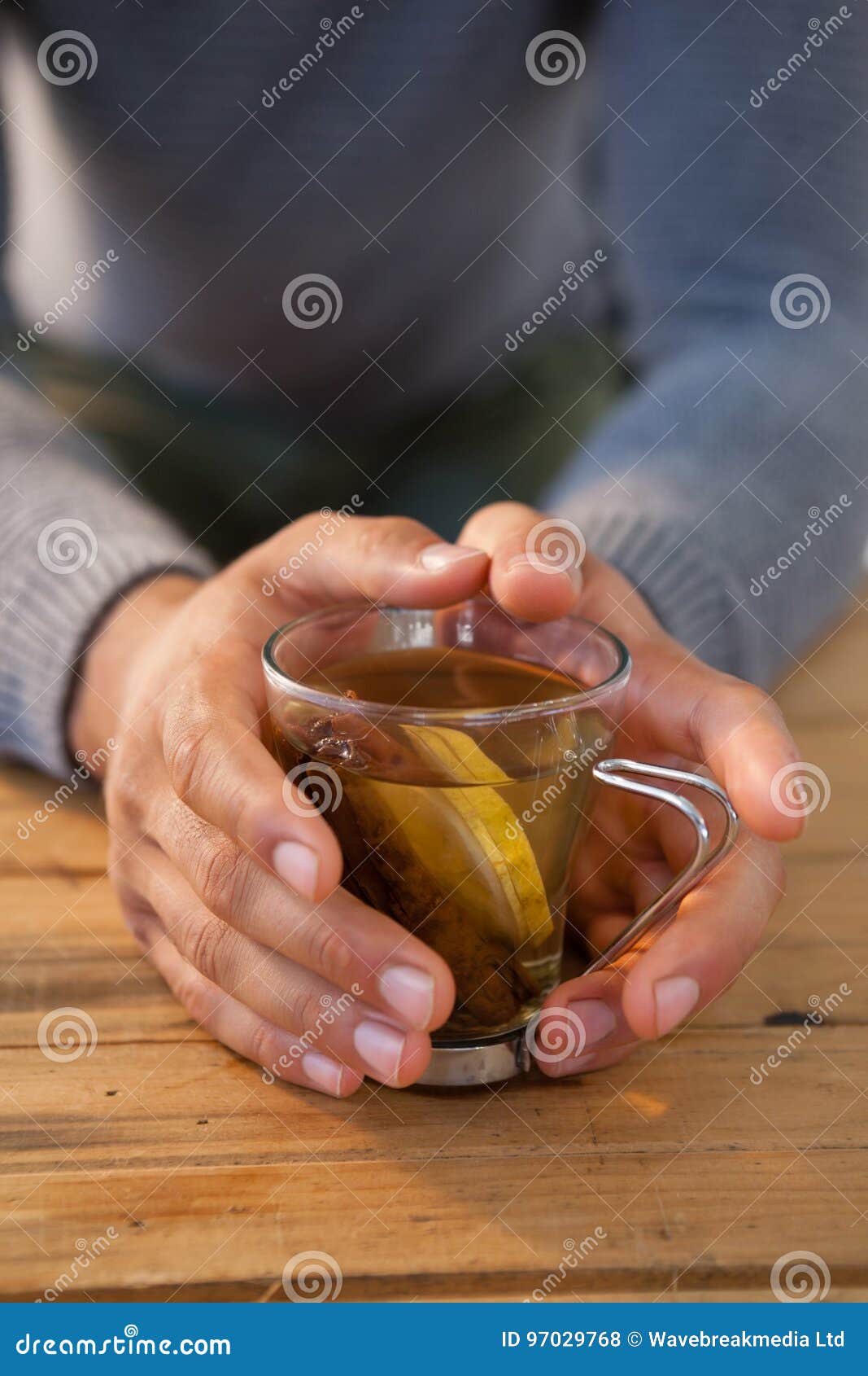Man Holding a Cup of Lemon Tea Stock Photo - Image of wood, caucasian ...