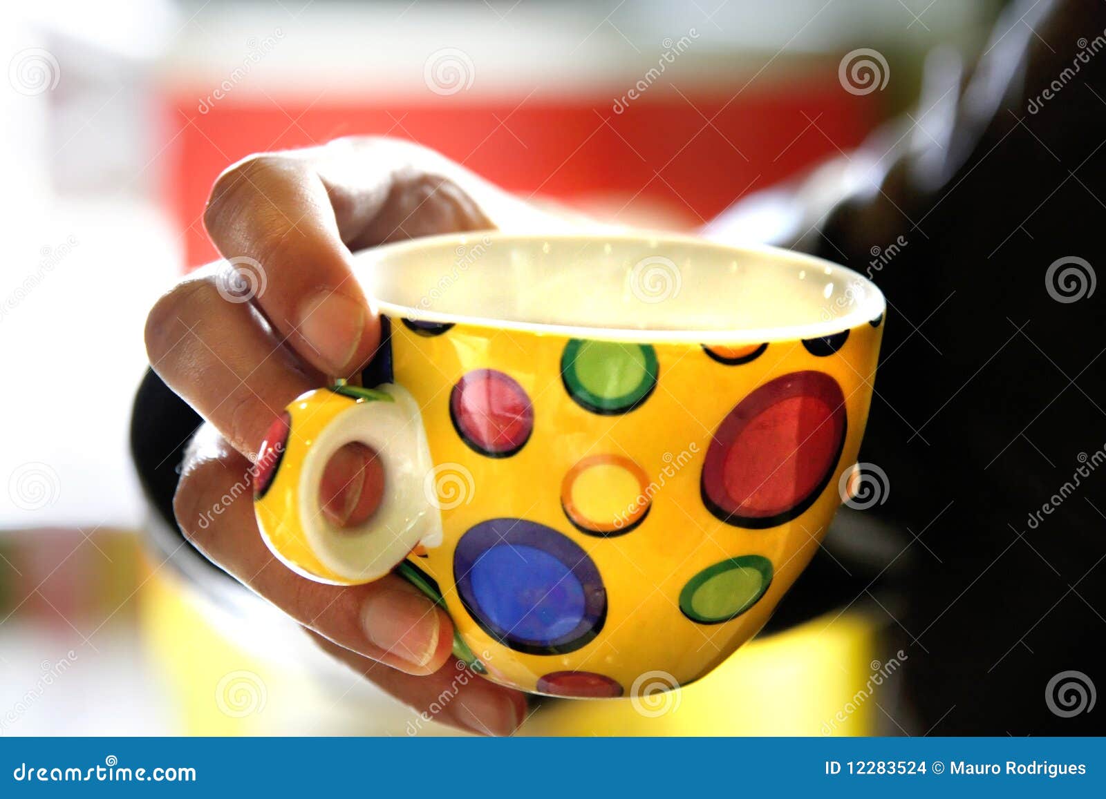 Man holding a cup of tea stock photo. Image of yellow - 12283524