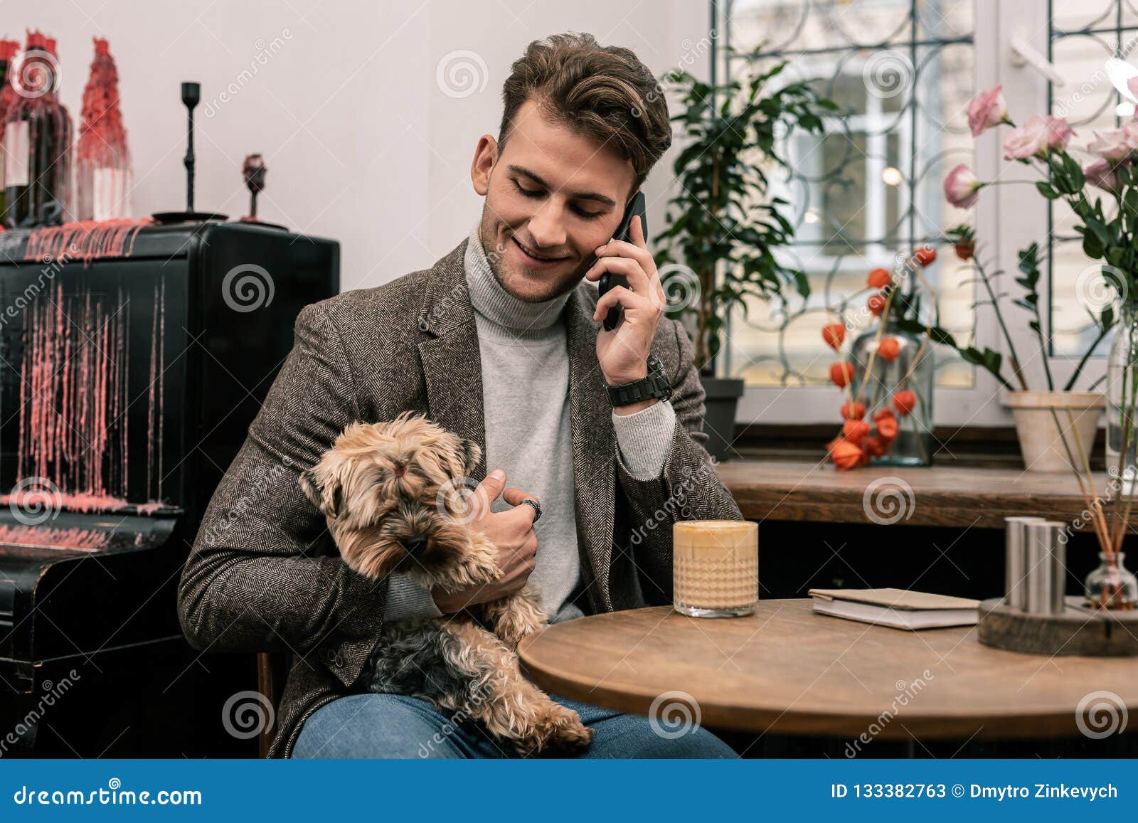 Man Holding a Dog while Making a Phone Call Stock Image - Image of call ...