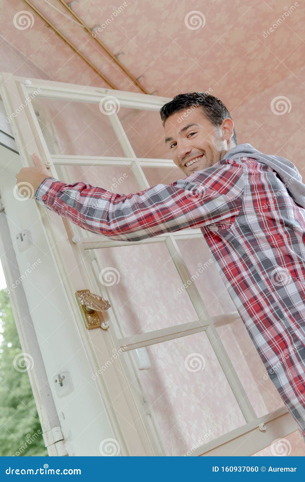 Man holding door stock photo. Image of handyman, panes - 160937060