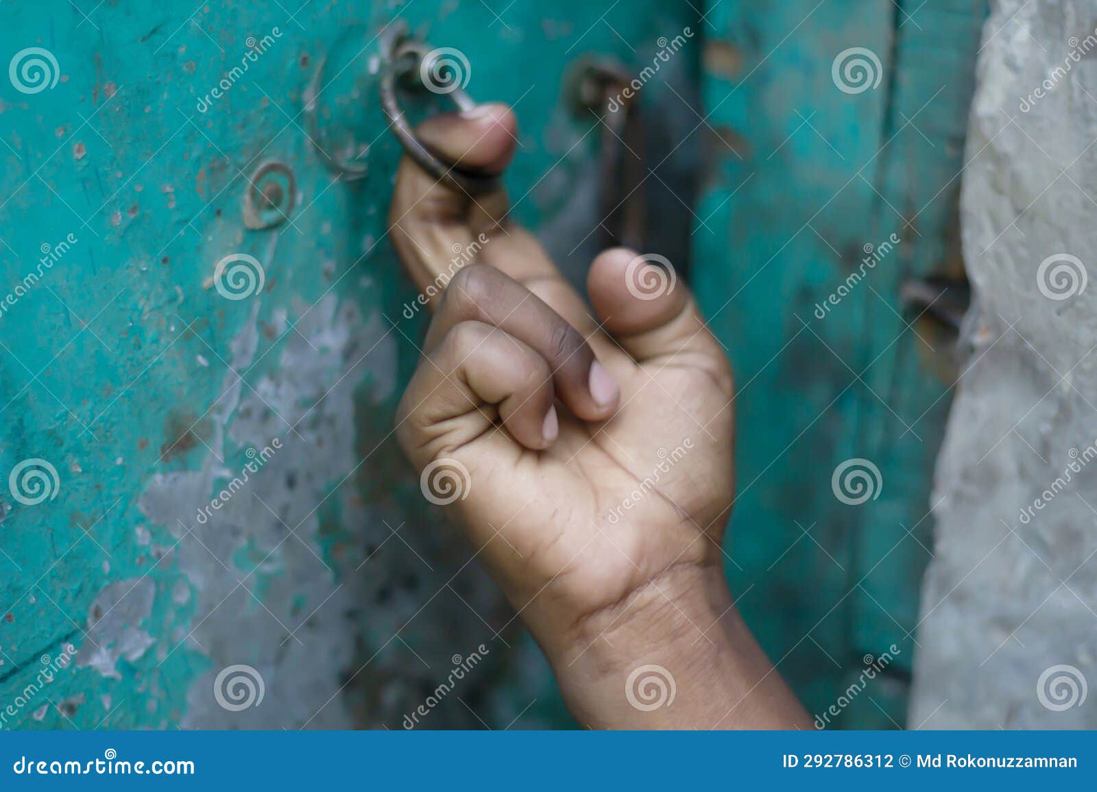 A Man is Holding Door Lock with Hands and Blurred Background Stock ...