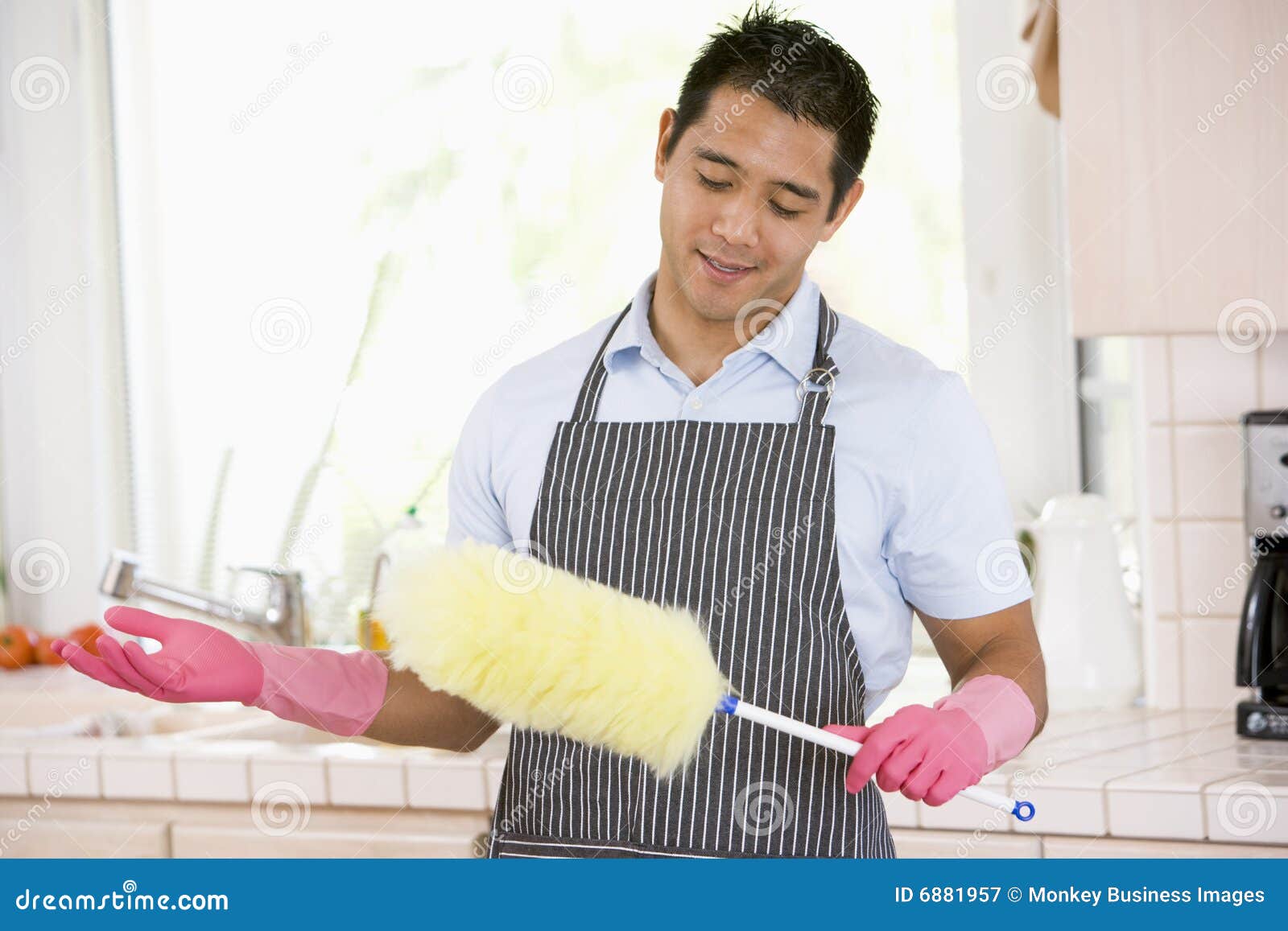 Man Holding Duster and Wearing Rubber Gloves Stock Image - Image of ...
