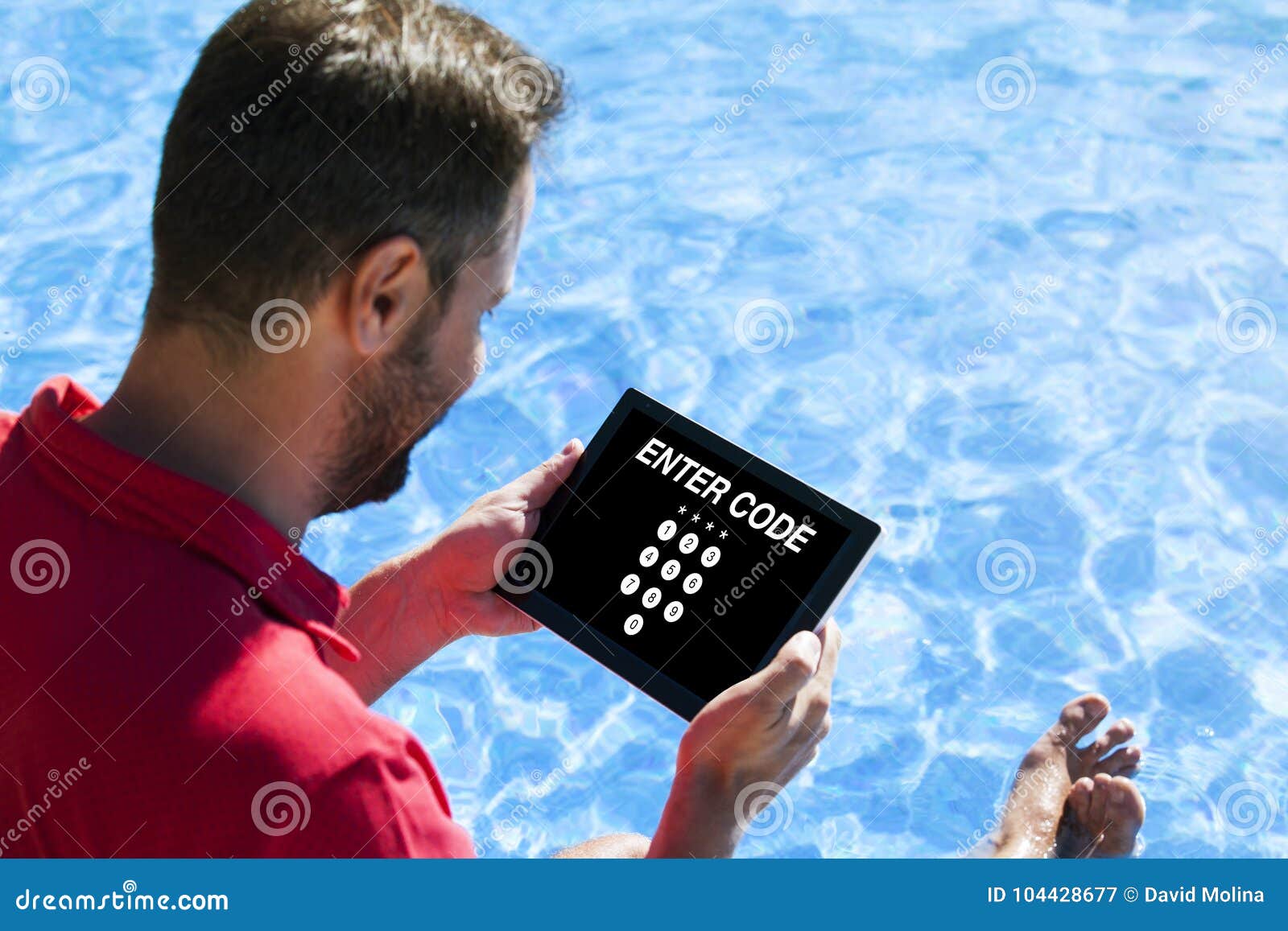 Man Holding an Electronic Tablet with ENTER CODE Access Page in Stock ...