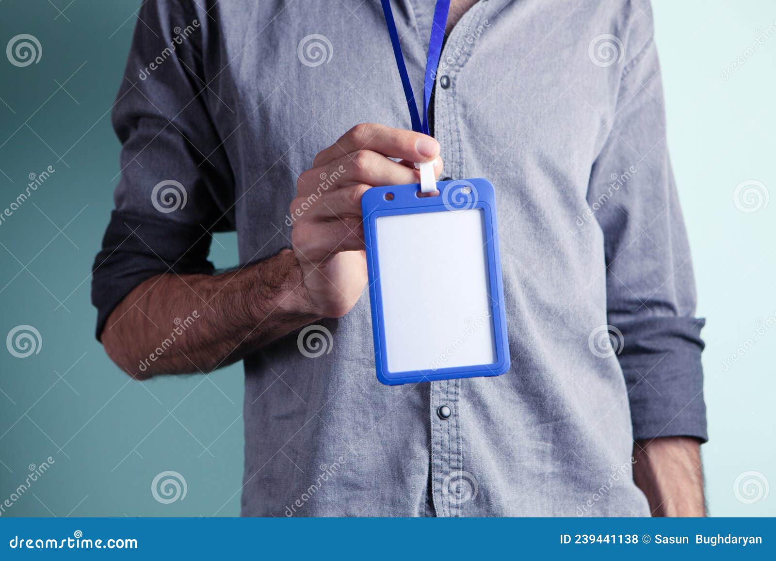 A Man Holding an Employee ID Tag Stock Photo - Image of hand, pass ...