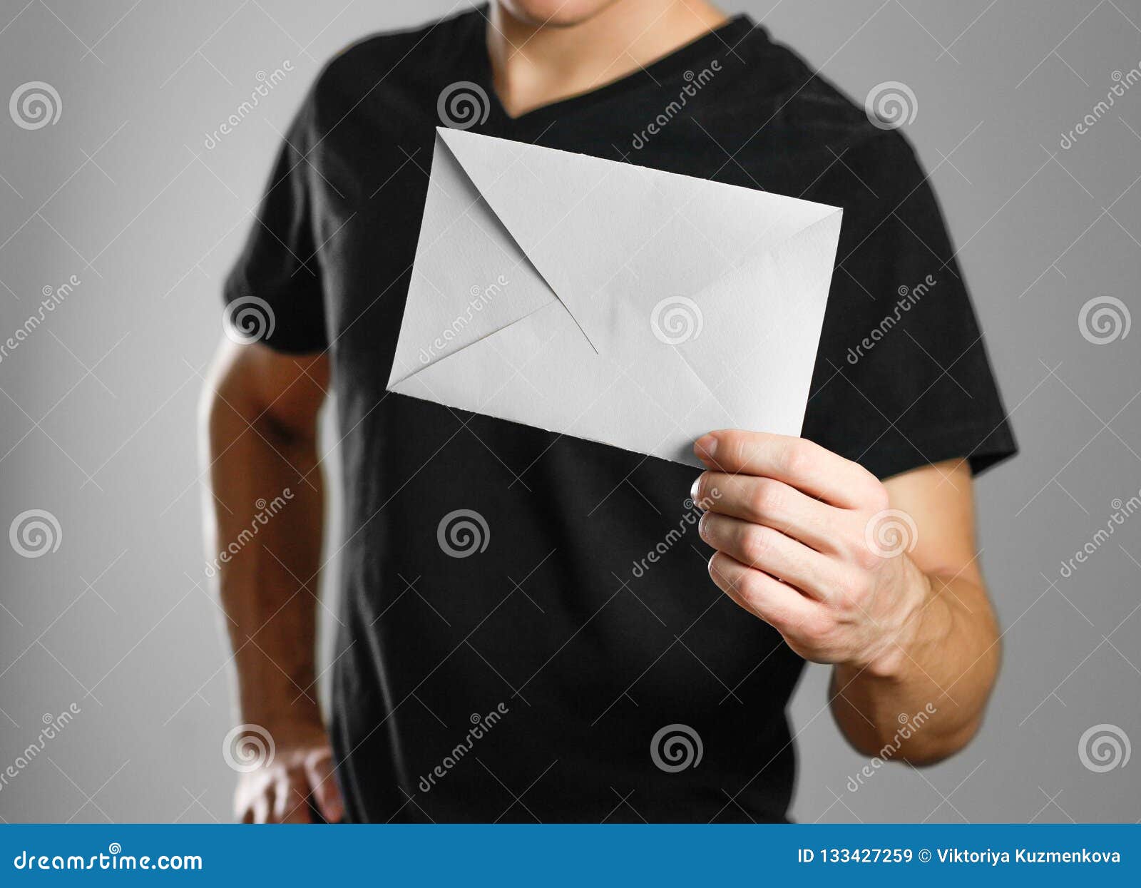 A Man Holding an Envelope. on Grey Background Stock Image - Image of ...
