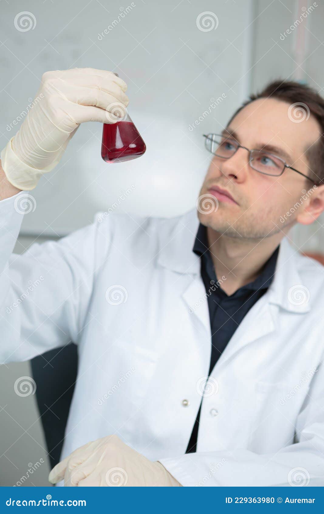 Man Holding Erlenmeyer Flask Stock Photo - Image of sample, scientific ...