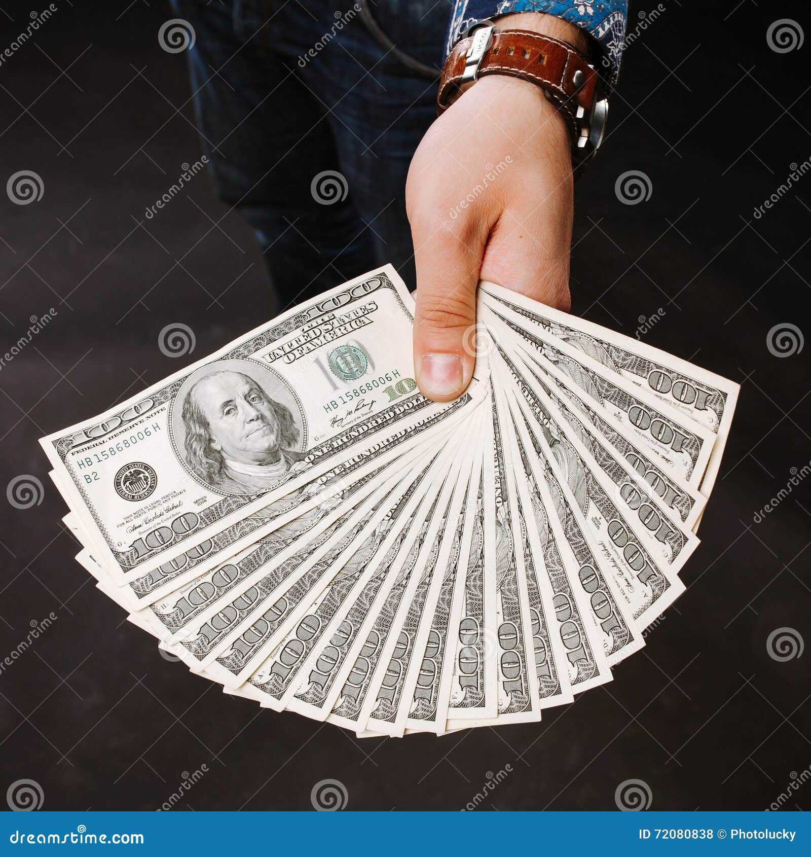 Man Holding Fan of Dollar Banknotes. Shows on Camera for Money. Stock ...
