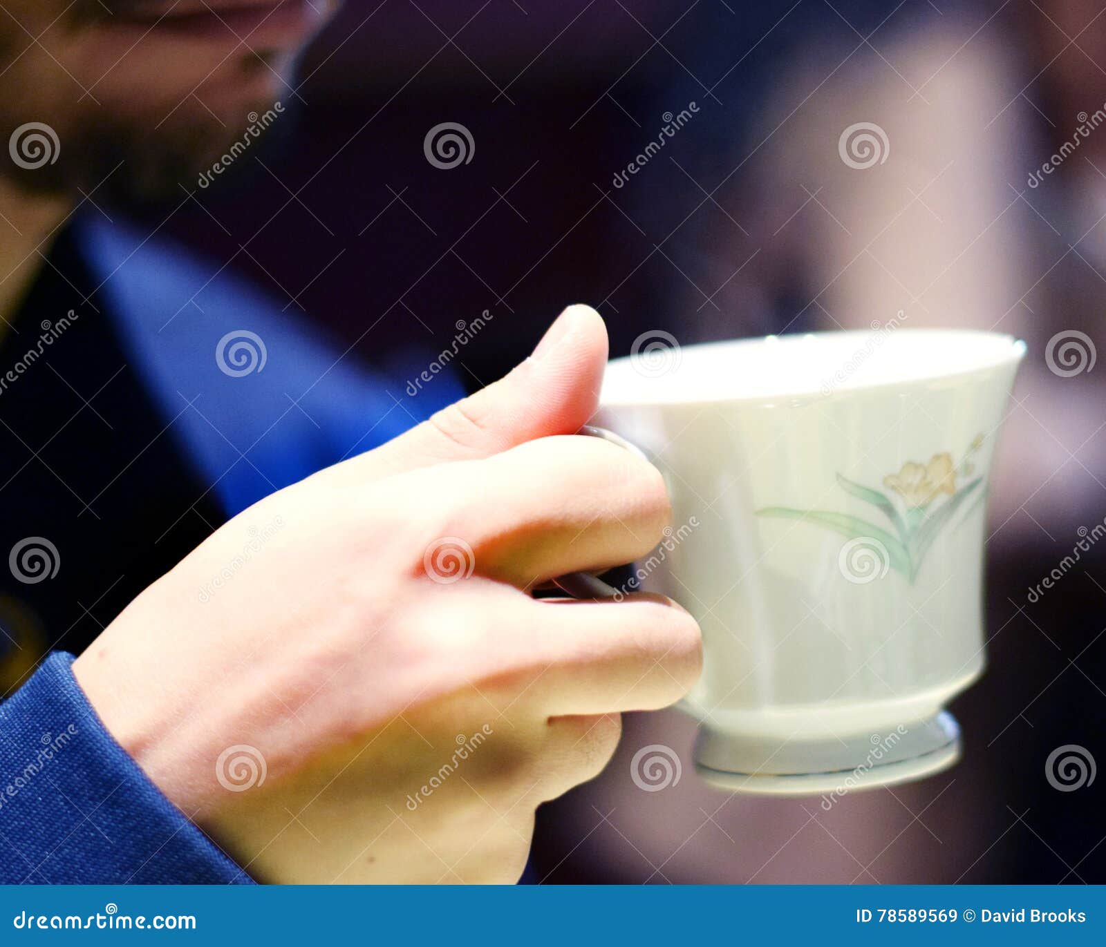 Man holding fancy teacup stock image. Image of britain - 78589569