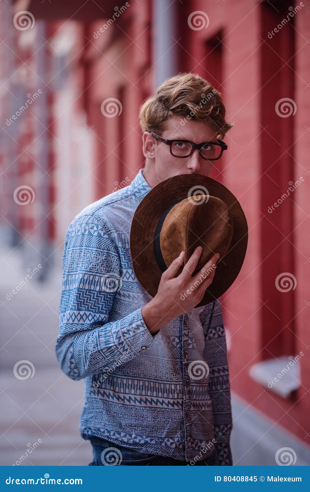 Man holding fedora stock image. Image of camera, looking - 80408845