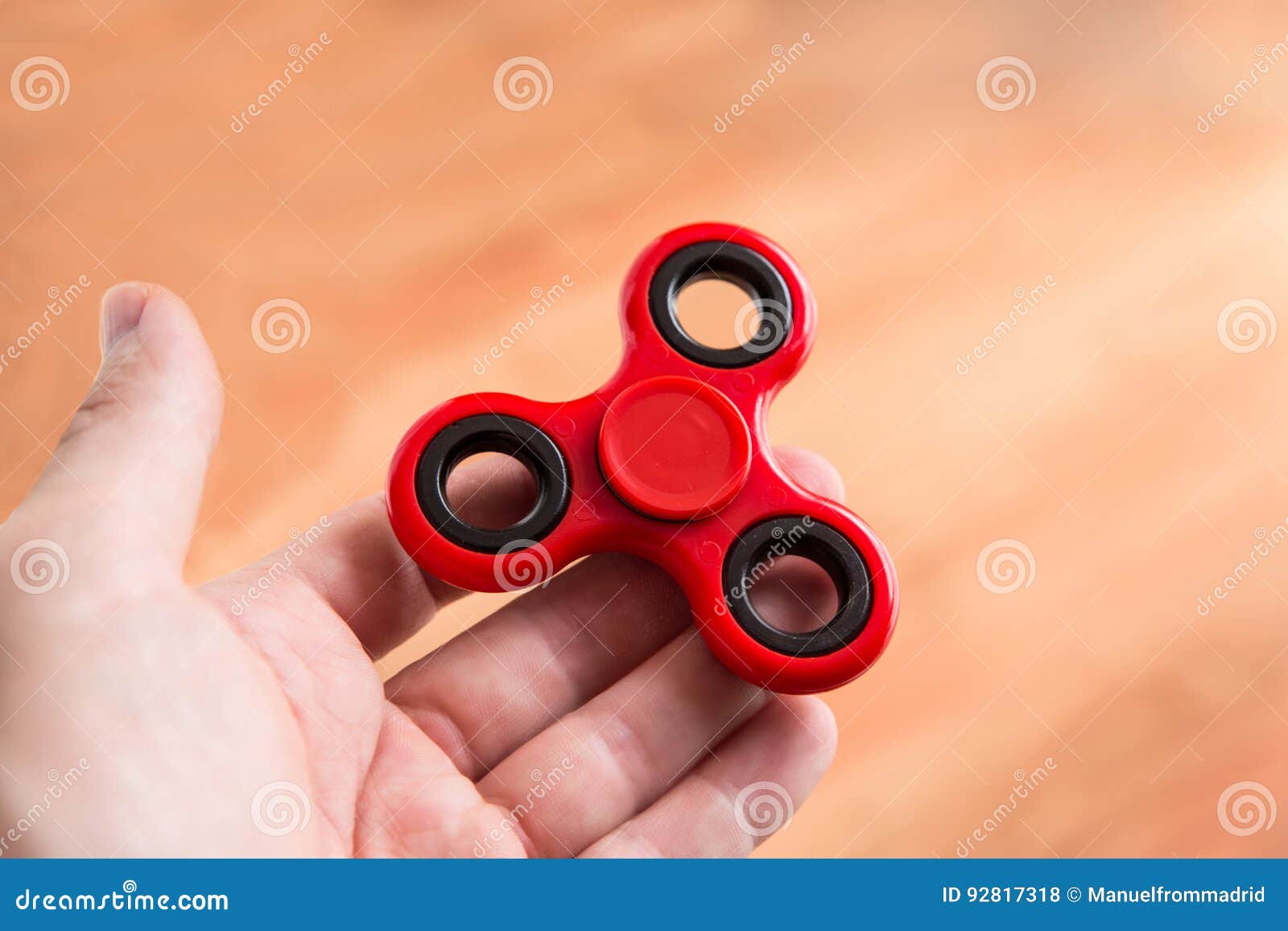 Man Holding a Fidget Spinner Stock Photo - Image of still, steel: 92817318