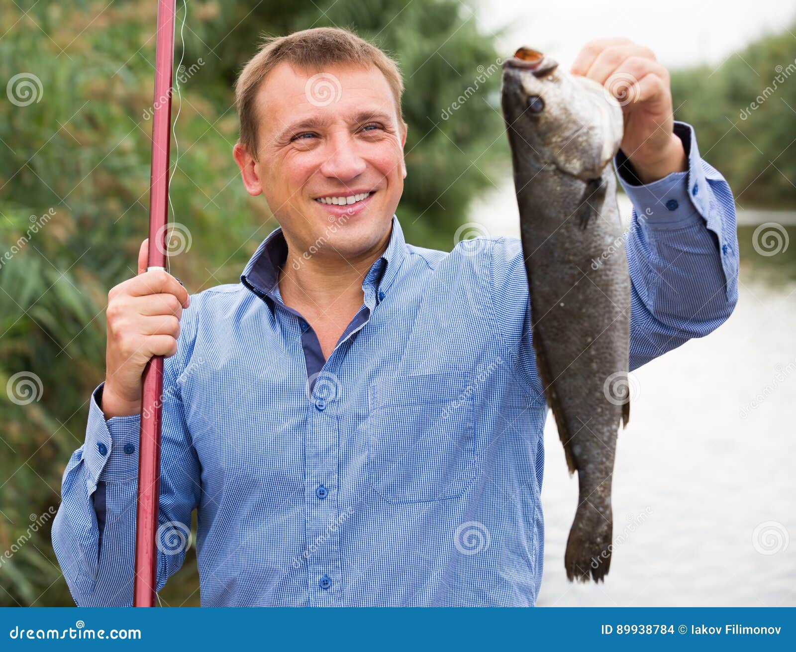 Man Holding Fish after Fishing Stock Photo - Image of pole, bait: 89938784